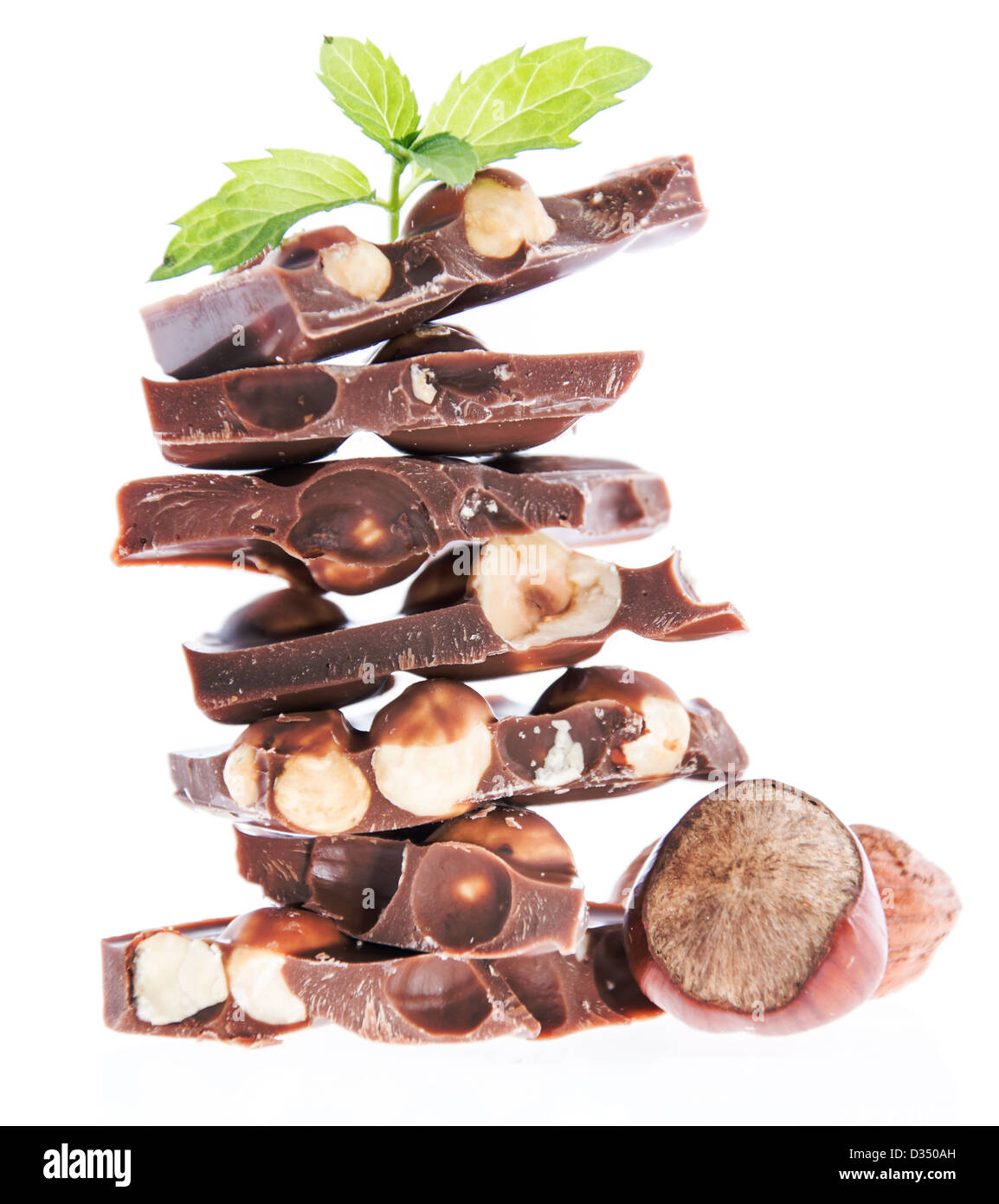 Stacked pieces of dark Hazelnut Chocolate isolated on white background ...
