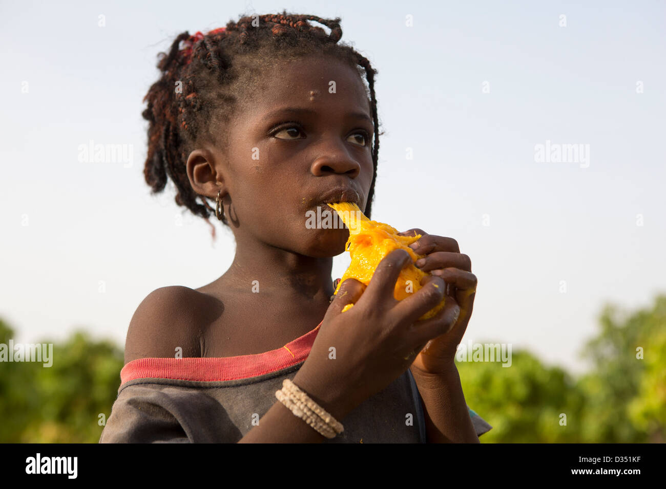 Cute Baby Eating Mango