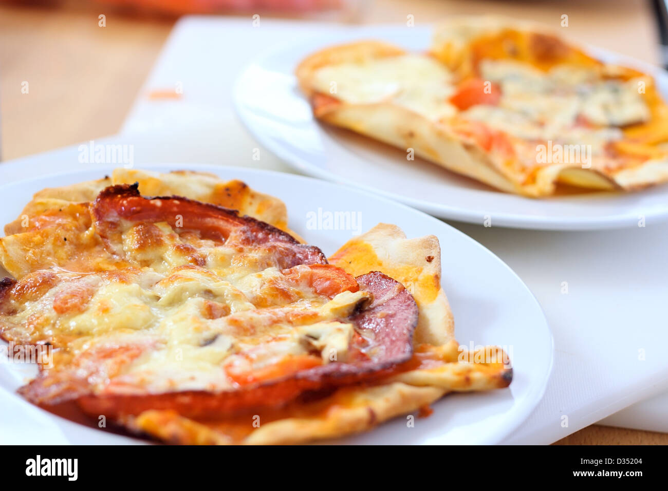Some pizza on the plates Stock Photo - Alamy