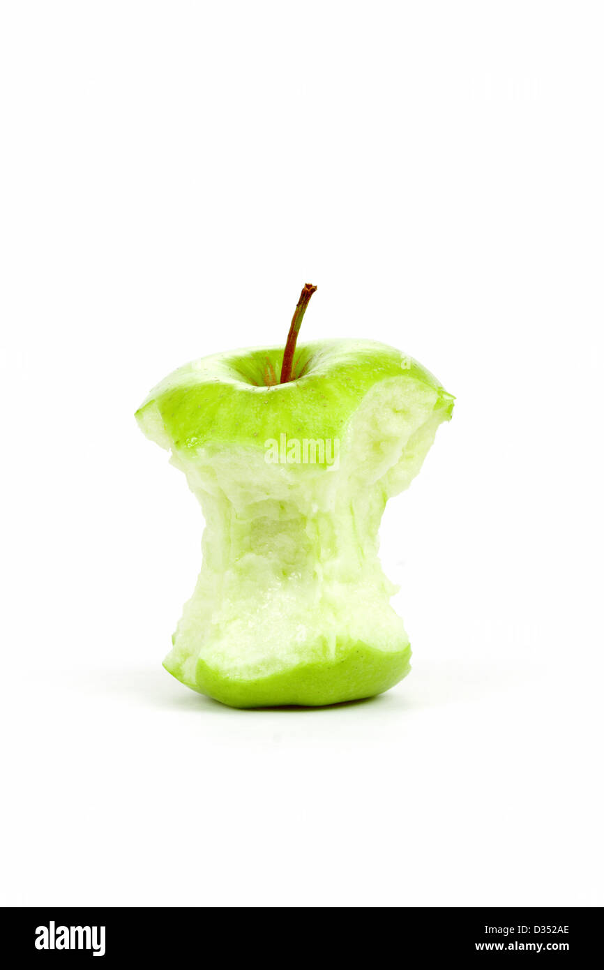 Green bitten apple isolated on white background Stock Photo - Alamy