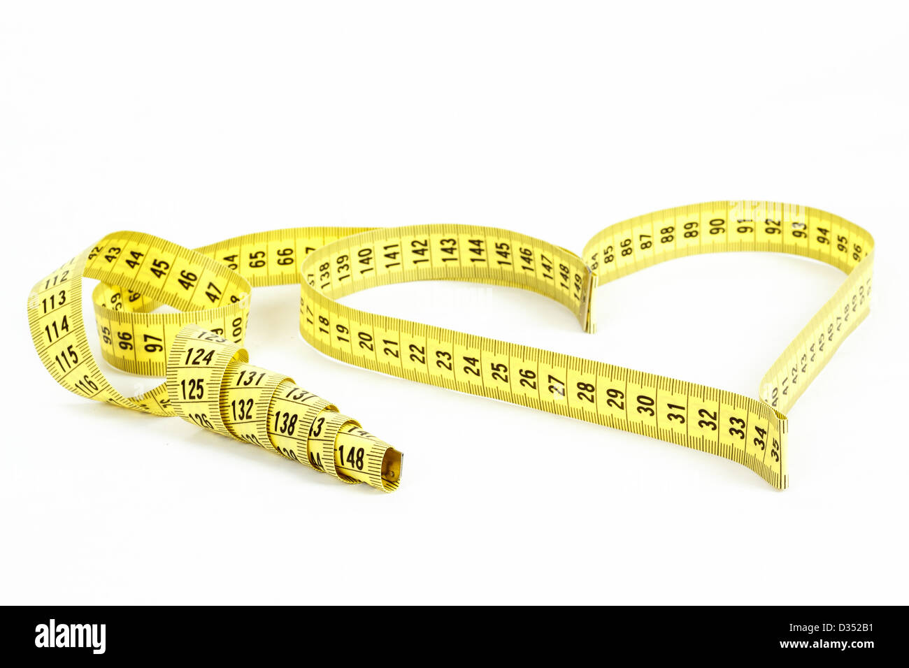 A measuring tape shaping a heart isolated on white background Stock ...