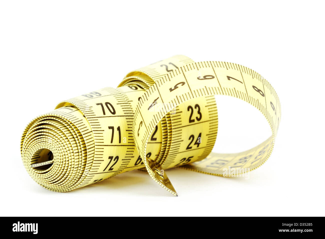 Yellow measuring tape isolated on white background Stock Photo - Alamy