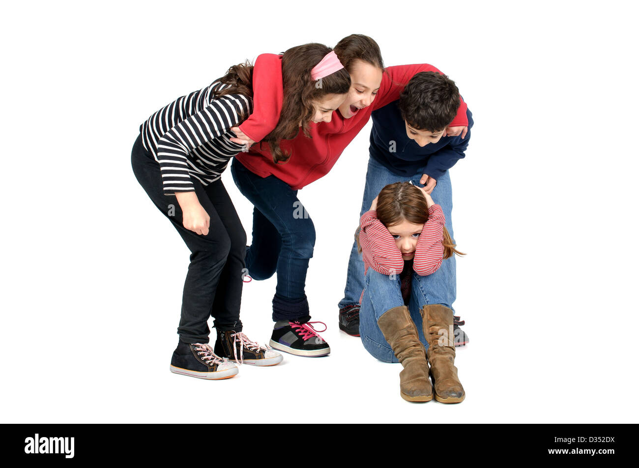 Group of children bullying an isolated child Stock Photo - Alamy