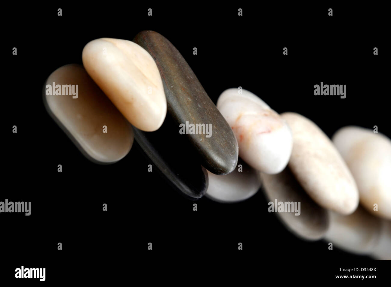 Concept made by many rocks isolated on black Stock Photo - Alamy