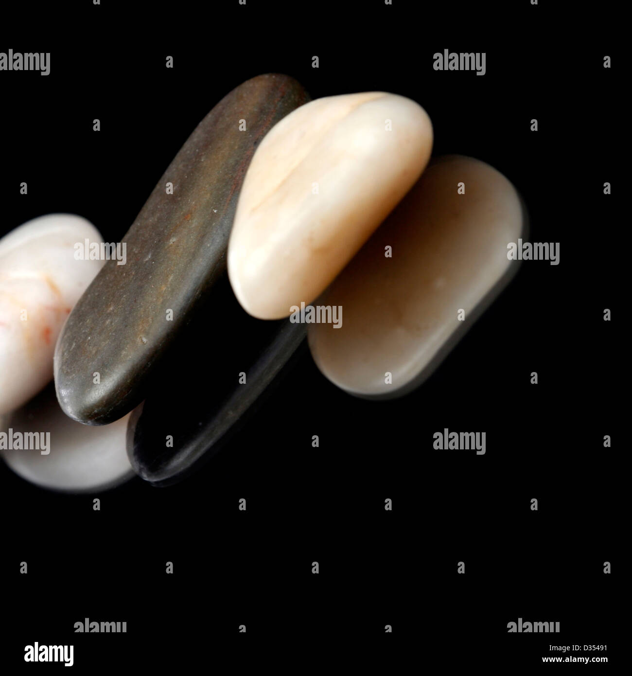 Concept made by many rocks isolated on black Stock Photo - Alamy