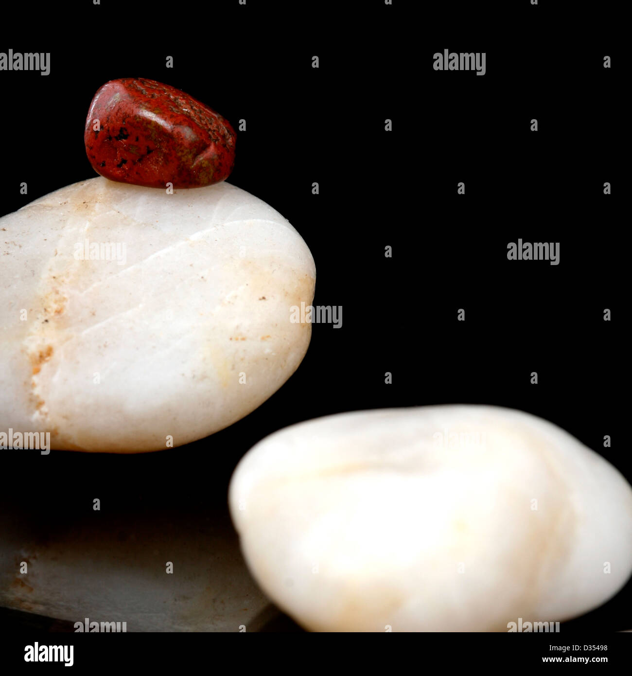 Concept made by many rocks isolated on black Stock Photo - Alamy