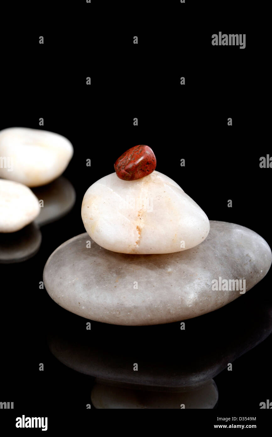 Concept made by many rocks isolated on black Stock Photo - Alamy