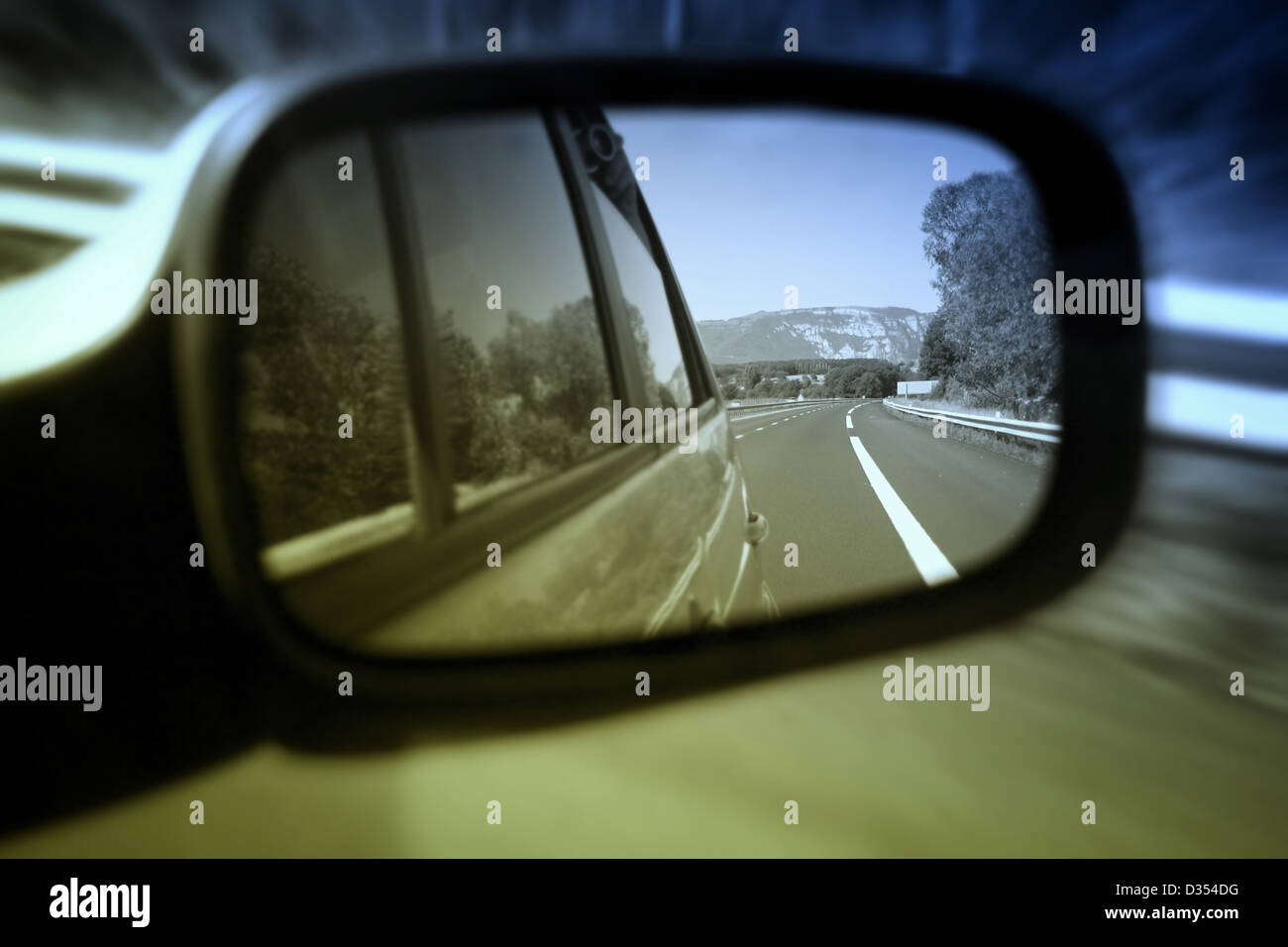 Road seen in a car mirror Stock Photo - Alamy