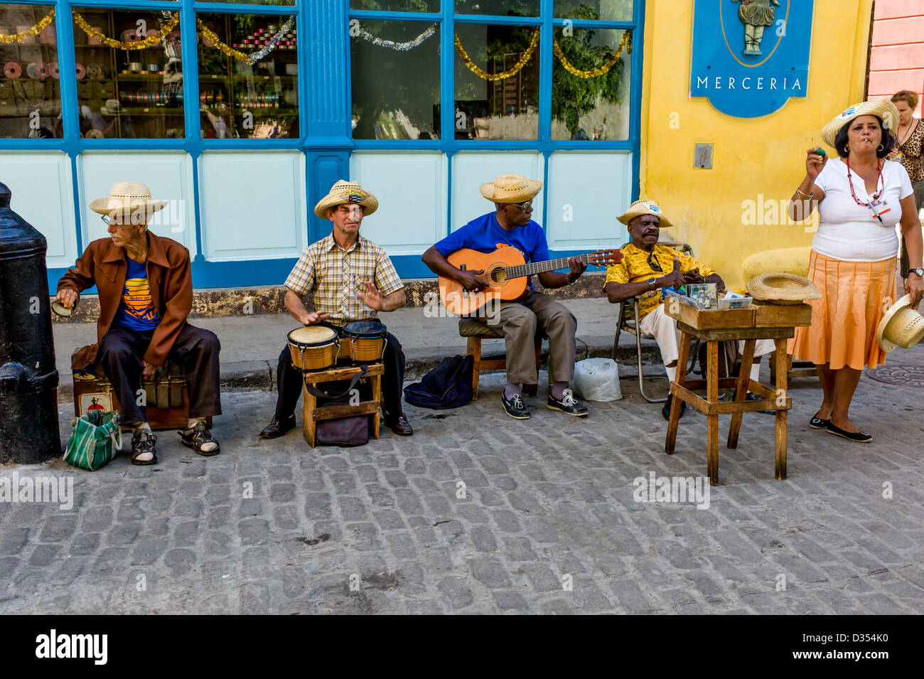 Five local singers and bandsman play to local tourists in old Havana ...