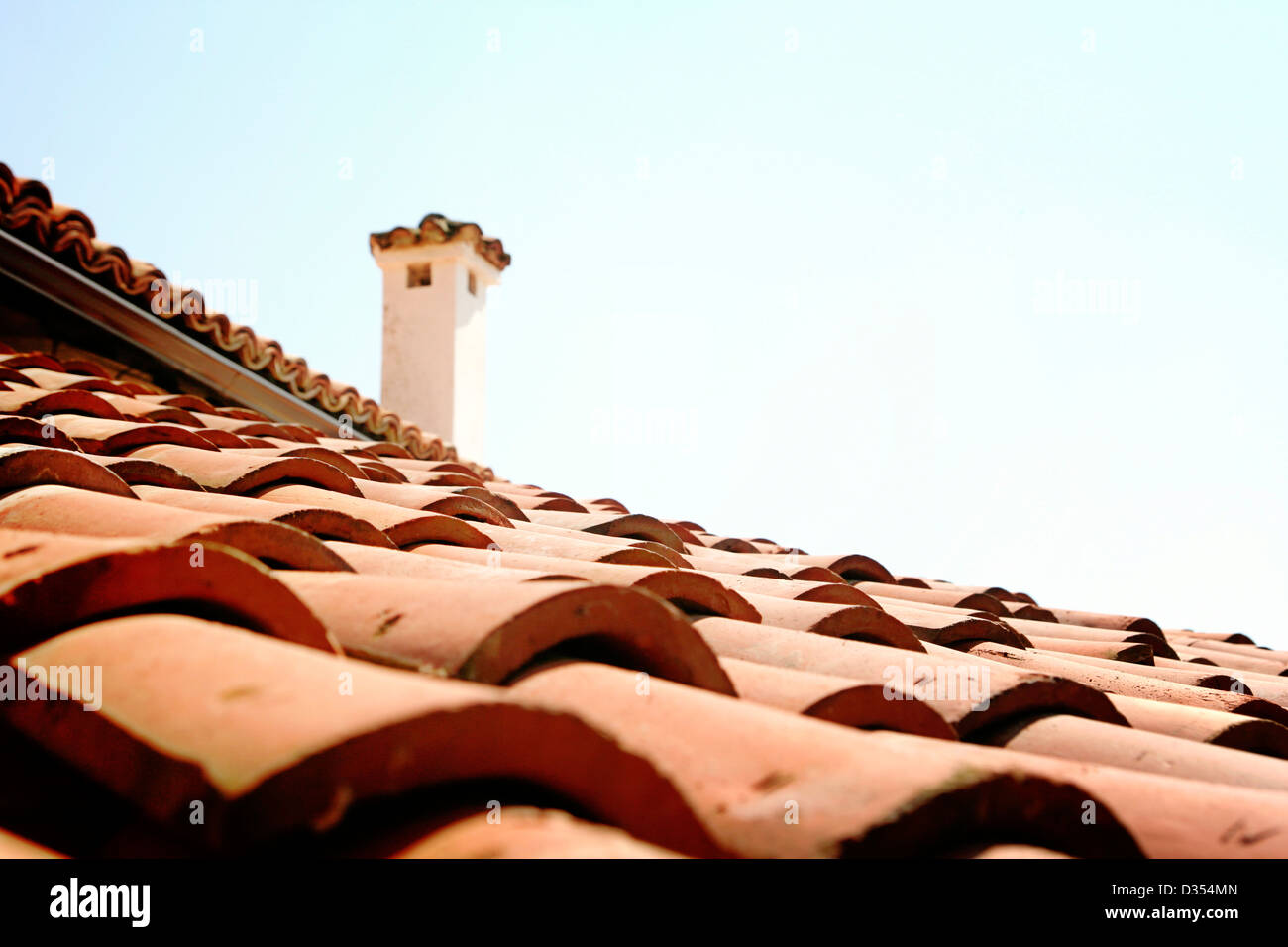 Red tile roof with chimney Stock Photo - Alamy