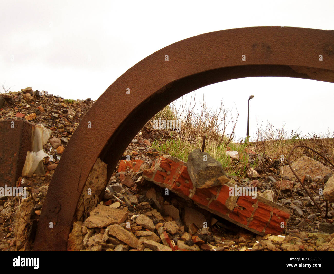 Bent structural steel beam in a fire damaged demolition site, Weston ...