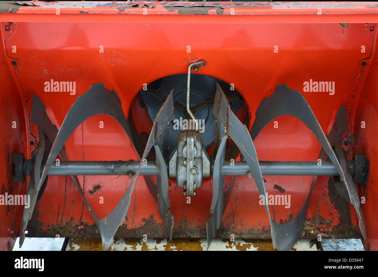 Closeup of old red snowblower and large metal auger Stock Photo - Alamy