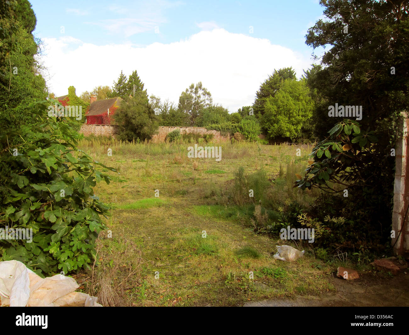 Plot of rough land ready for redevelopment or building of new homes, 12 ...