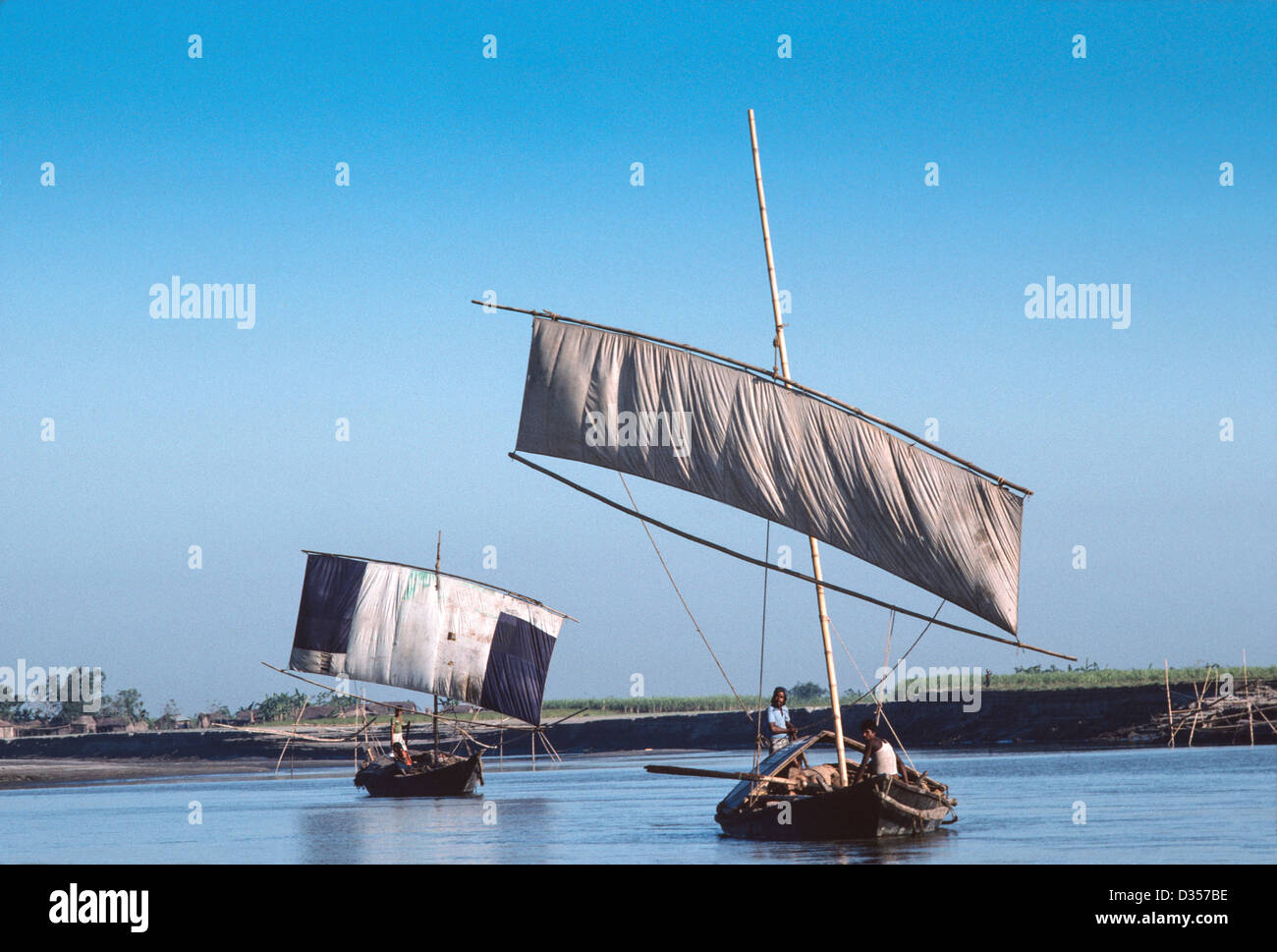 Sail boats carrying hardwood logs from the northern border with India ...