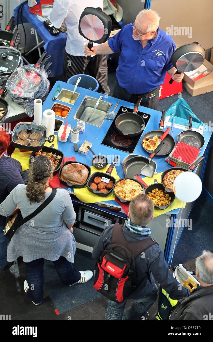 People visit a pan booth at the Home-Garden-Leisure consumer fair in ...
