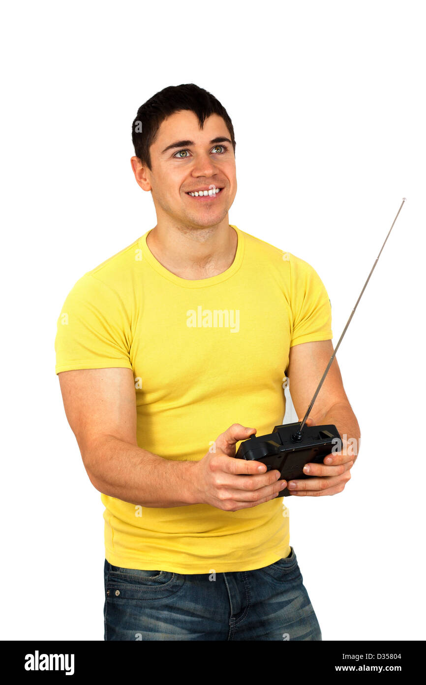 Young athletic man holding a radio remote control (controlling handset ...