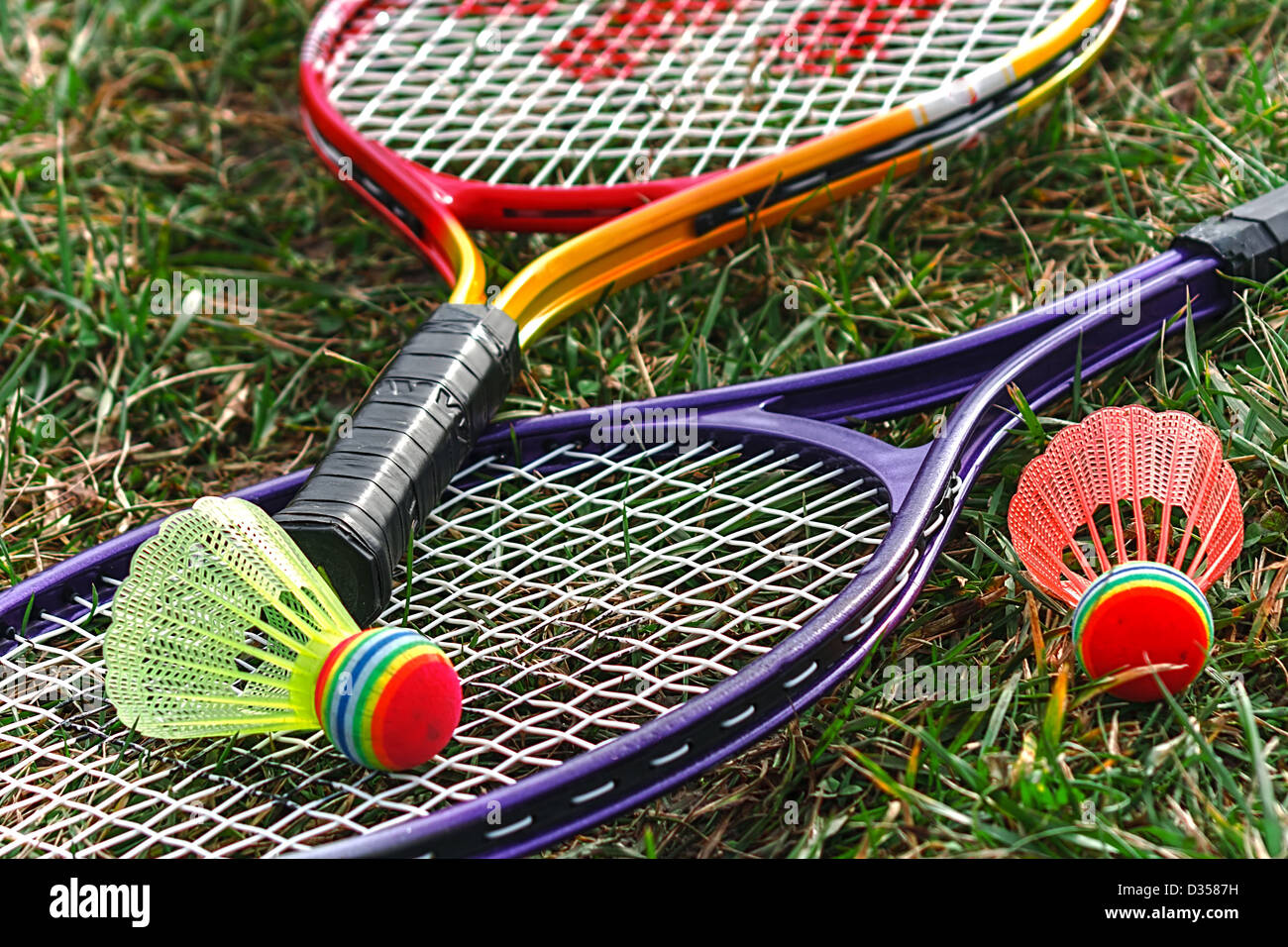 Badminton rackets and shuttlecocks placed on the grass Stock Photo - Alamy