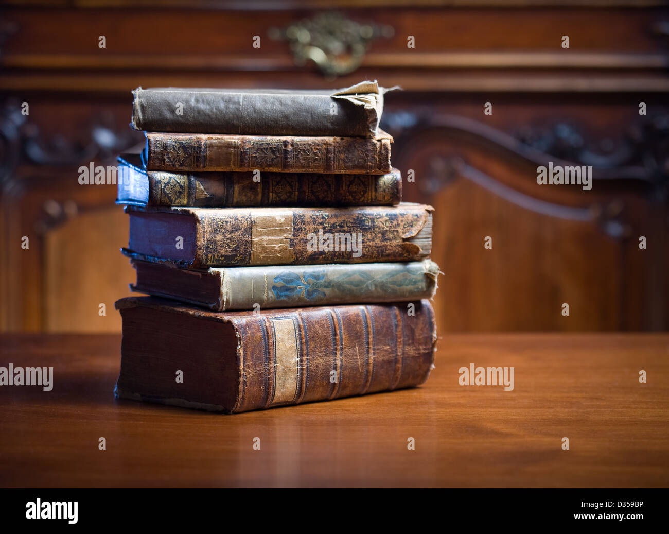 Beautiful antique books in very elegant setting Stock Photo - Alamy
