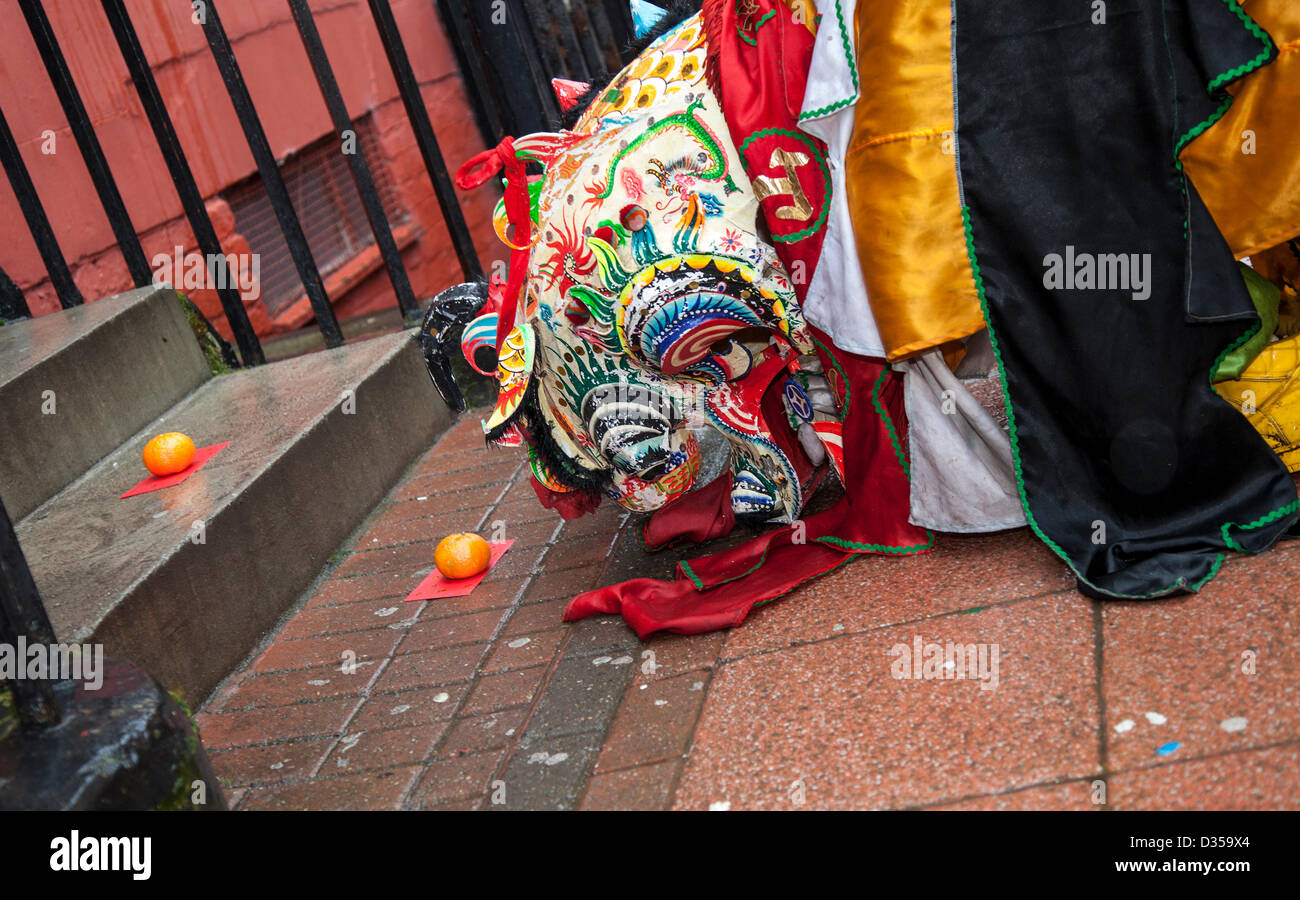 Dragon offering on steps in Liverpool China Town. February 2013. Dragon ...