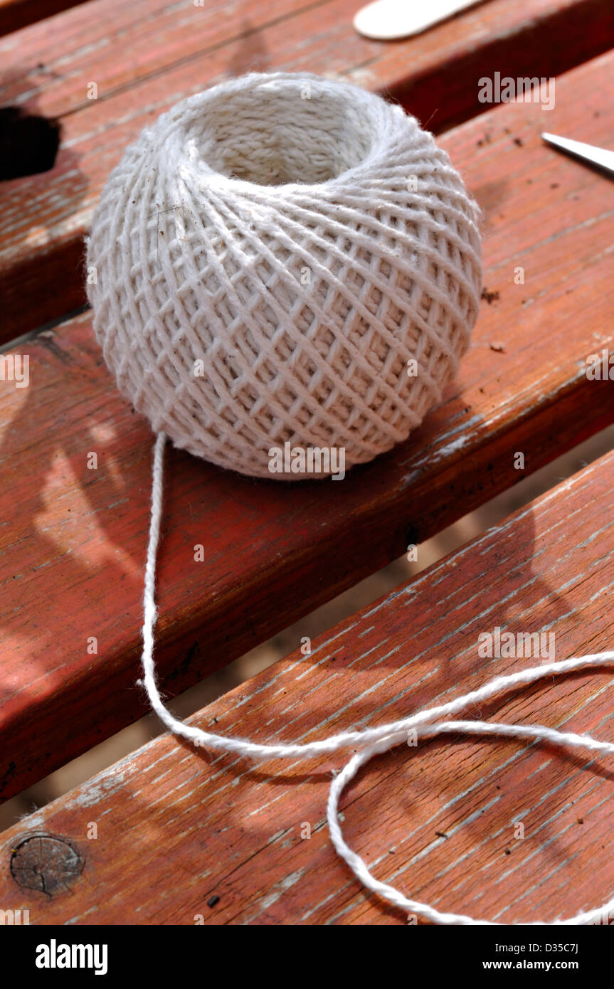 White Ball of String on Garden Bench Stock Photo - Alamy