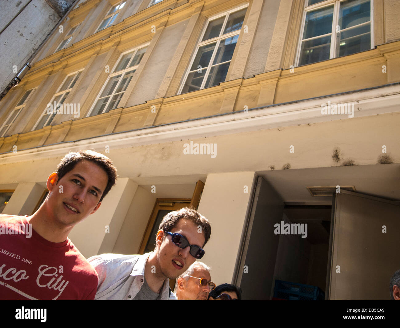 two yong men walking historical vienna Stock Photo - Alamy