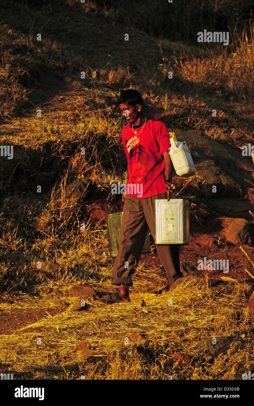 Man Carrying water on his shoulder, Maharashtra, India Stock Photo - Alamy