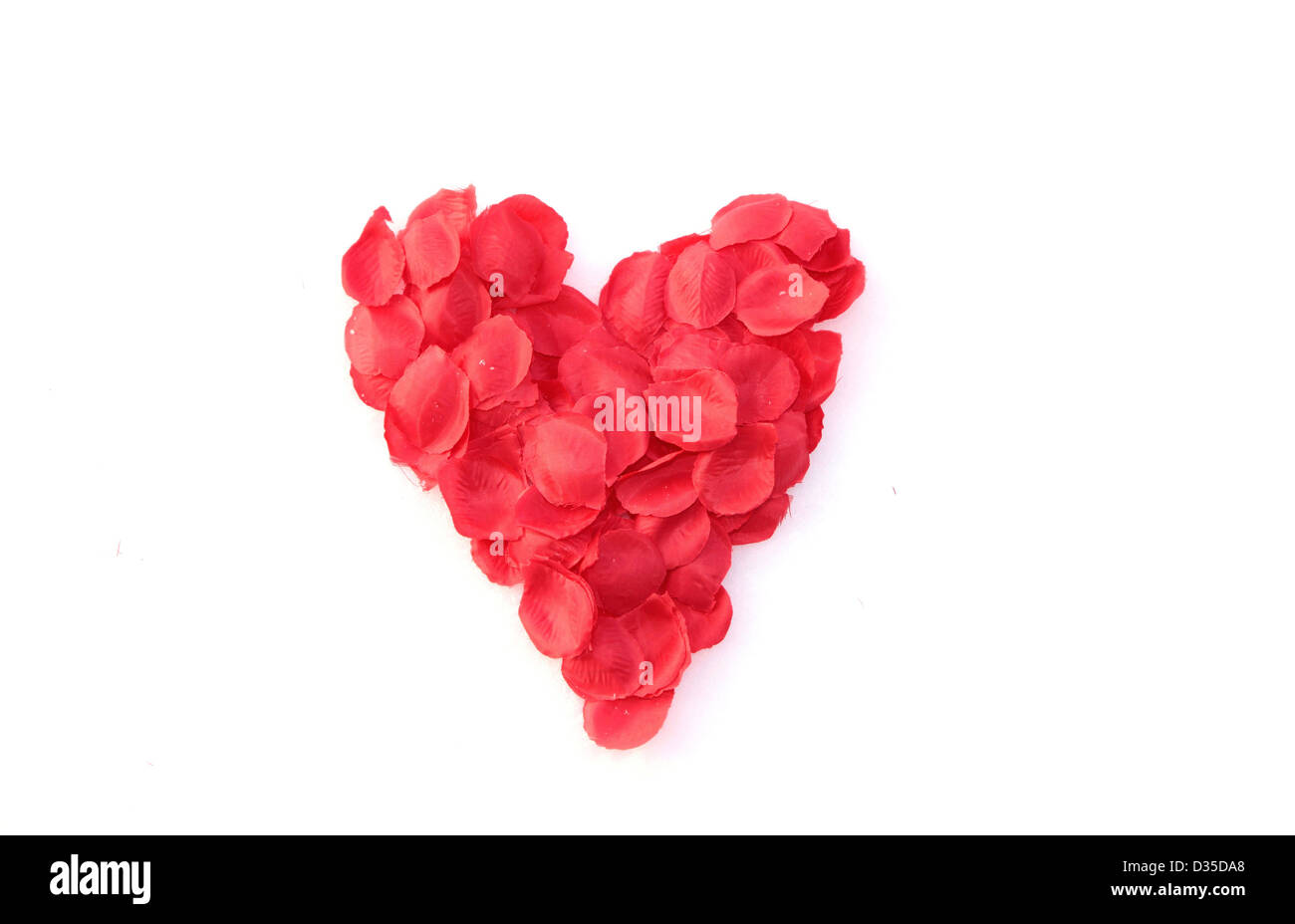 Hart of rose petals against a white background Stock Photo - Alamy