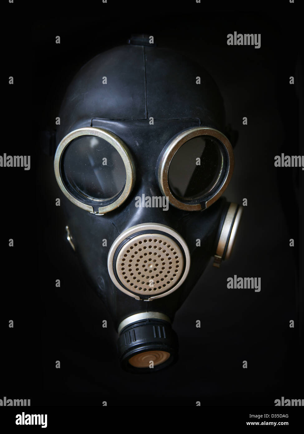 Unmodern gas mask on a black background Stock Photo - Alamy