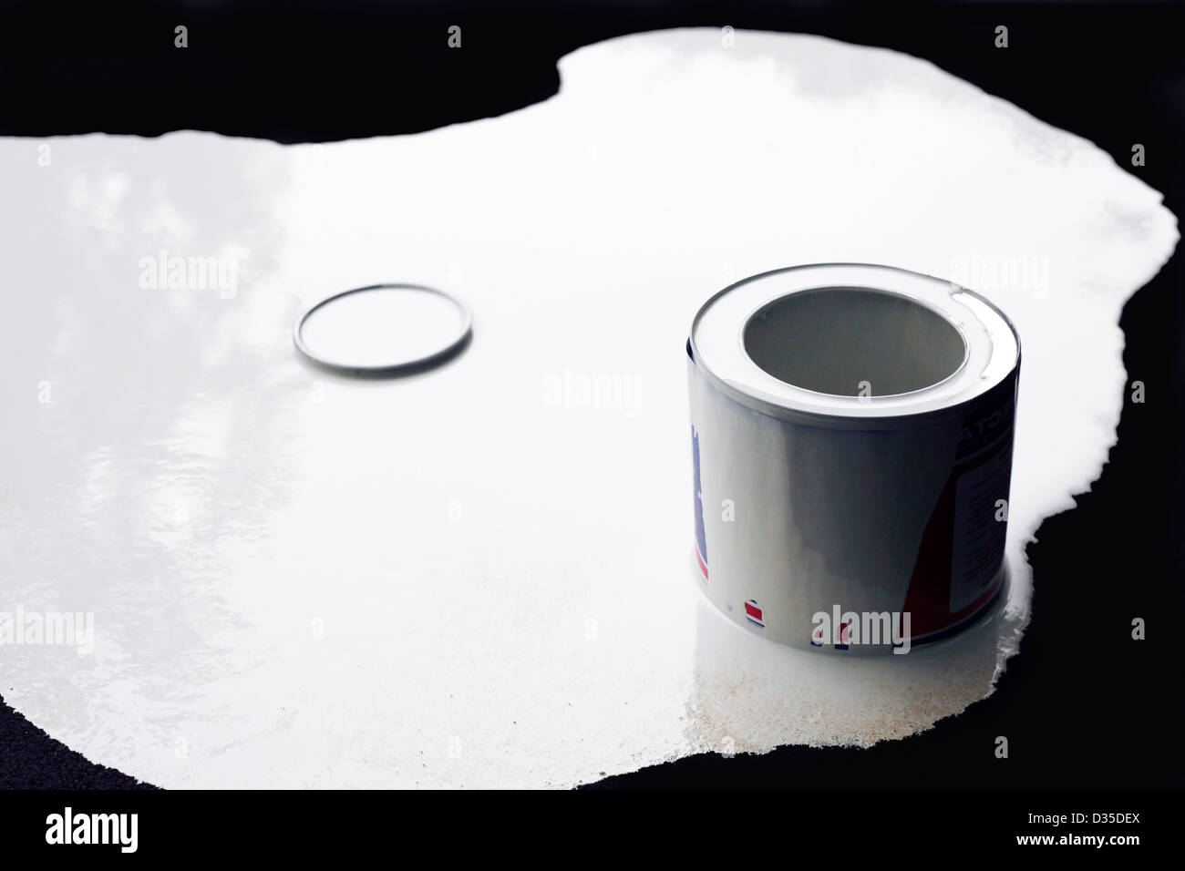 White paint is flowing down of black background Stock Photo - Alamy
