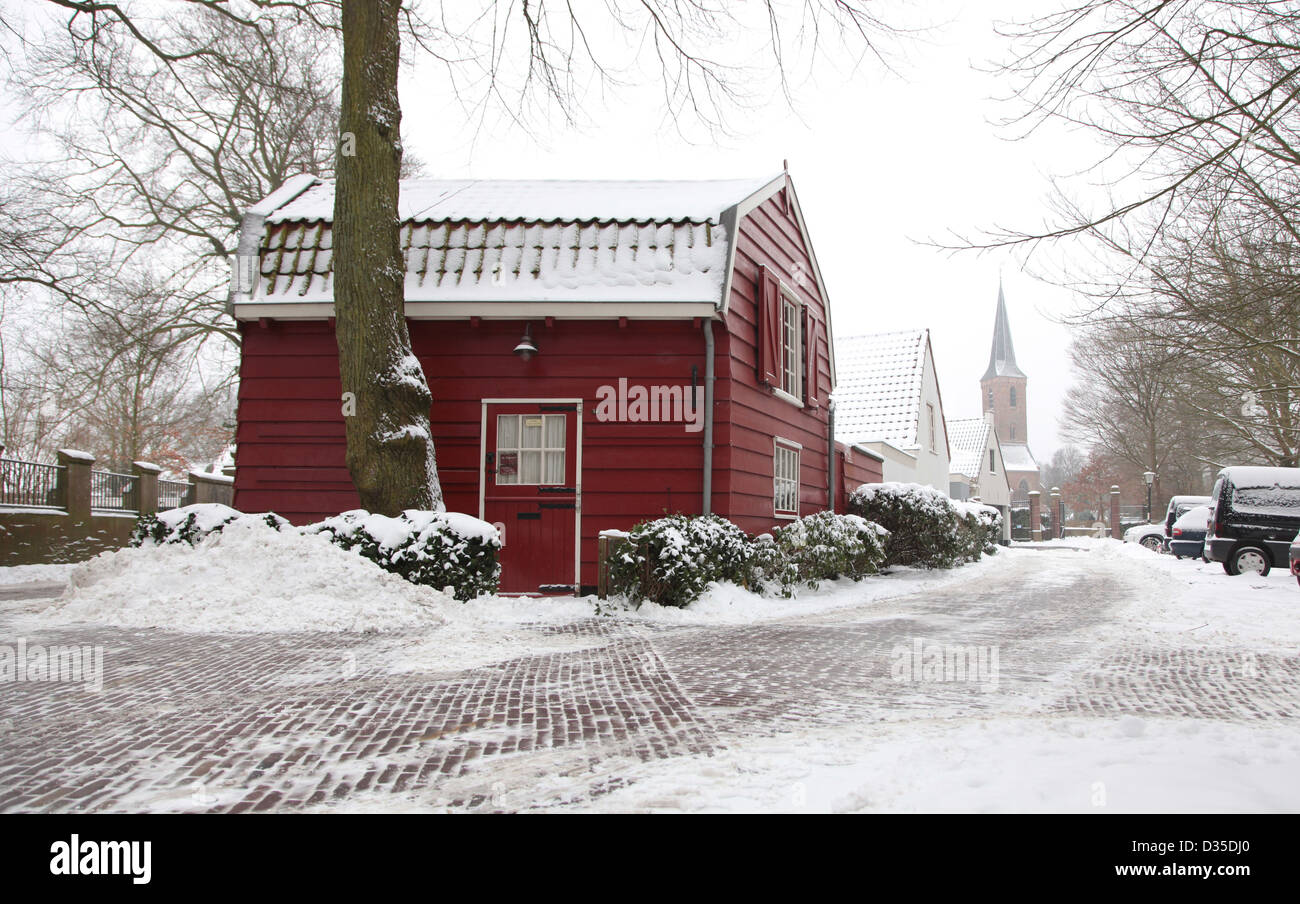 A house and church in Holland in wintertime Stock Photo - Alamy
