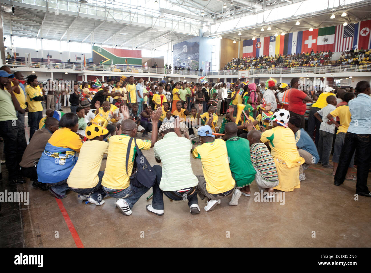 South African fans dancing and singing at the fan zone in Khayelithsa ...