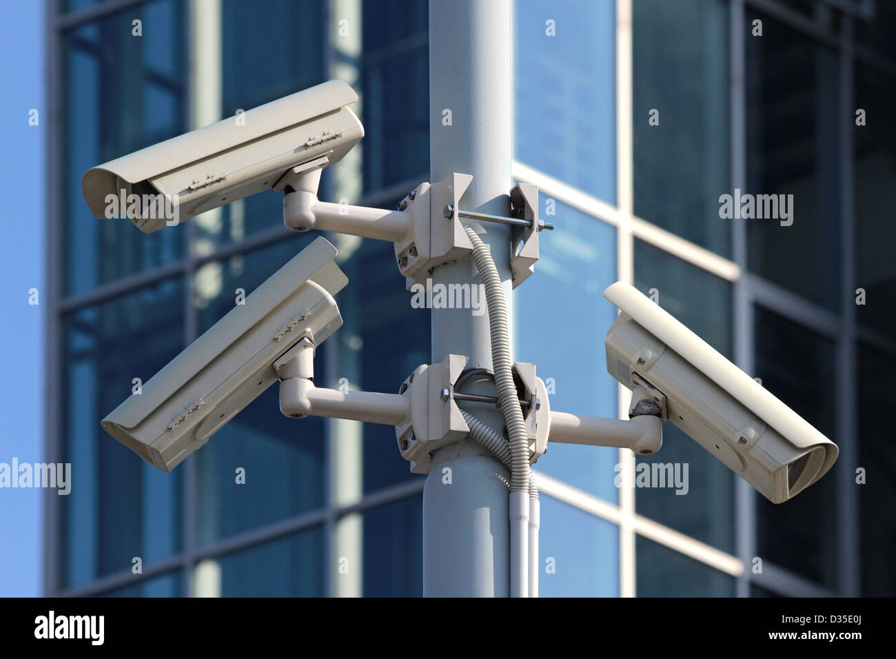 three cctv security cameras on the street pylon Stock Photo - Alamy