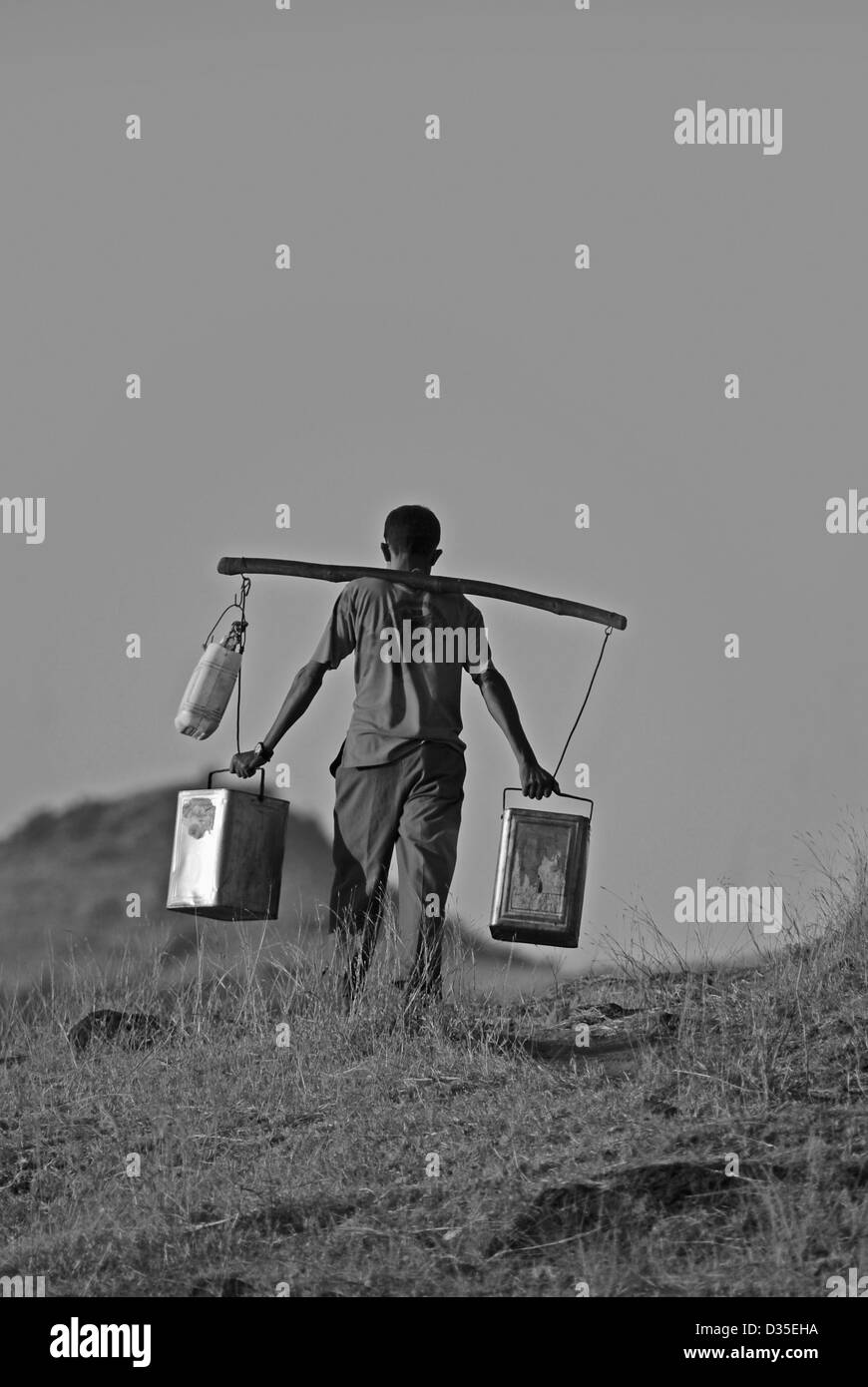 Man Carrying water on his shoulder, Maharashtra, India Stock Photo - Alamy