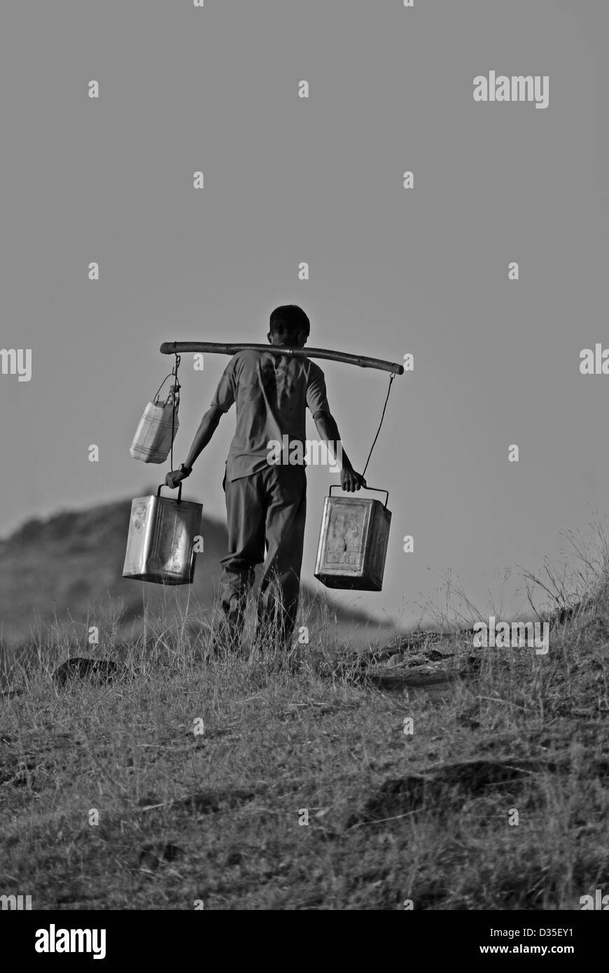 Man Carrying water on his shoulder, Maharashtra, India Stock Photo - Alamy