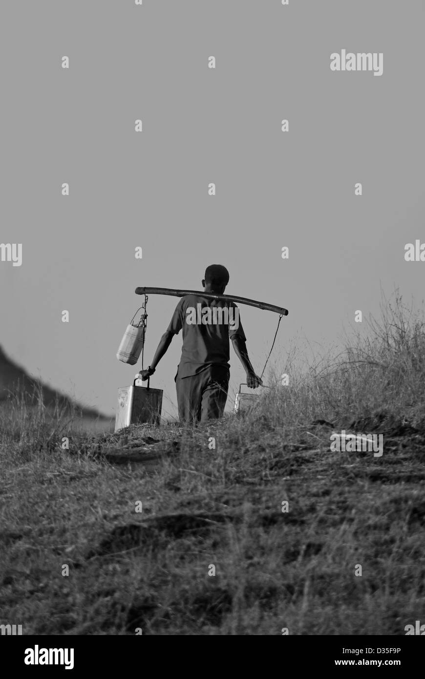 Man Carrying water on his shoulder, Maharashtra, India Stock Photo - Alamy