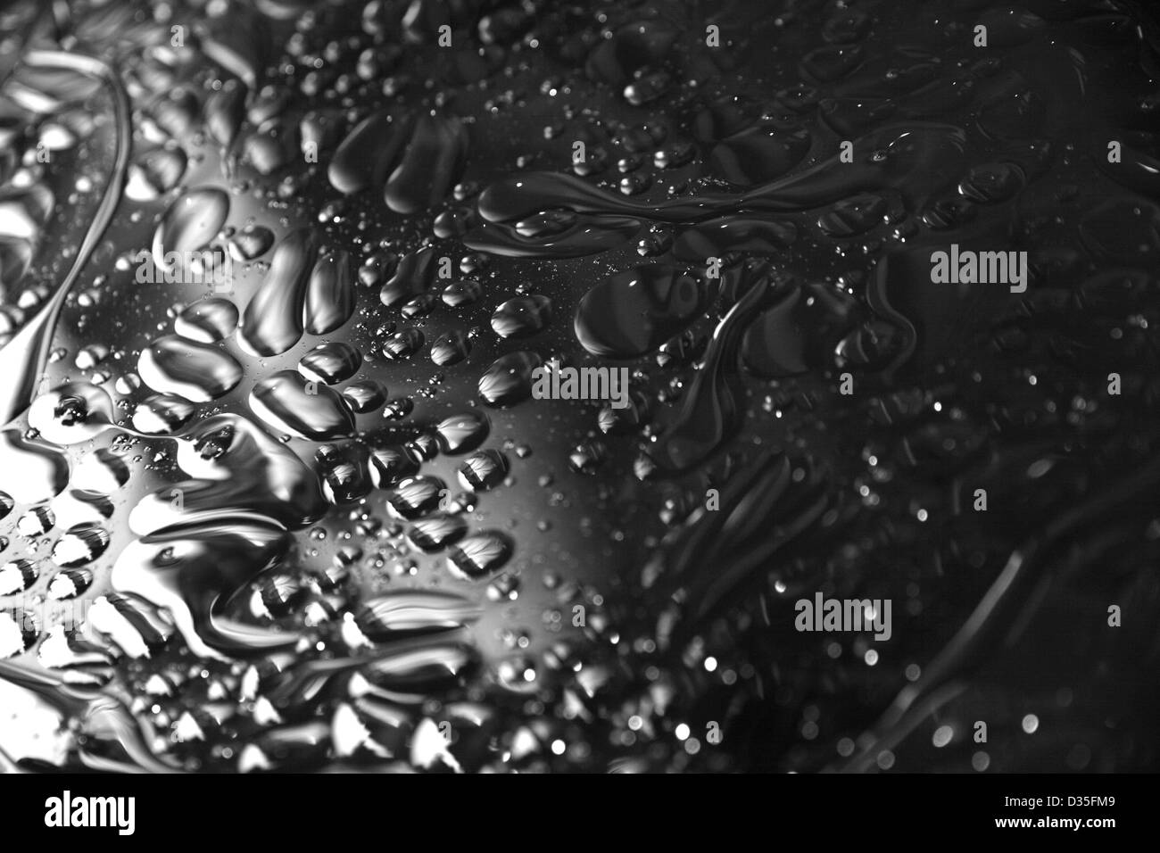 Oil floating on water Stock Photo - Alamy