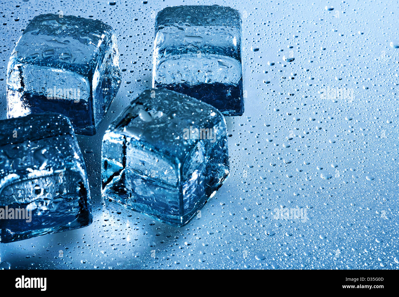 Ice cube and water drops on the wet background Stock Photo - Alamy