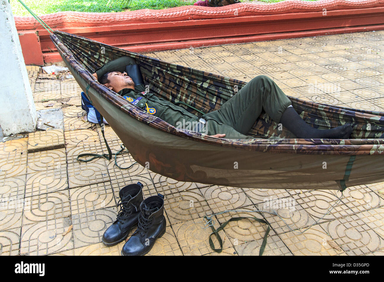 Military policeman naps in hammock, Phnom Penh, Cambodia Stock Photo ...