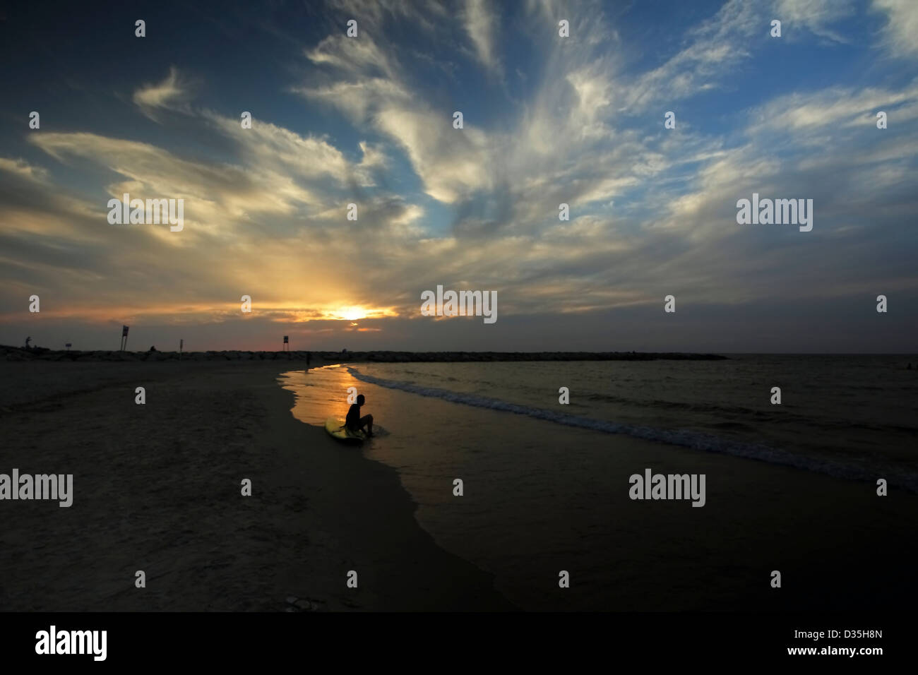 Scenic view with distorted landscape and sky with silhouetted figures ...