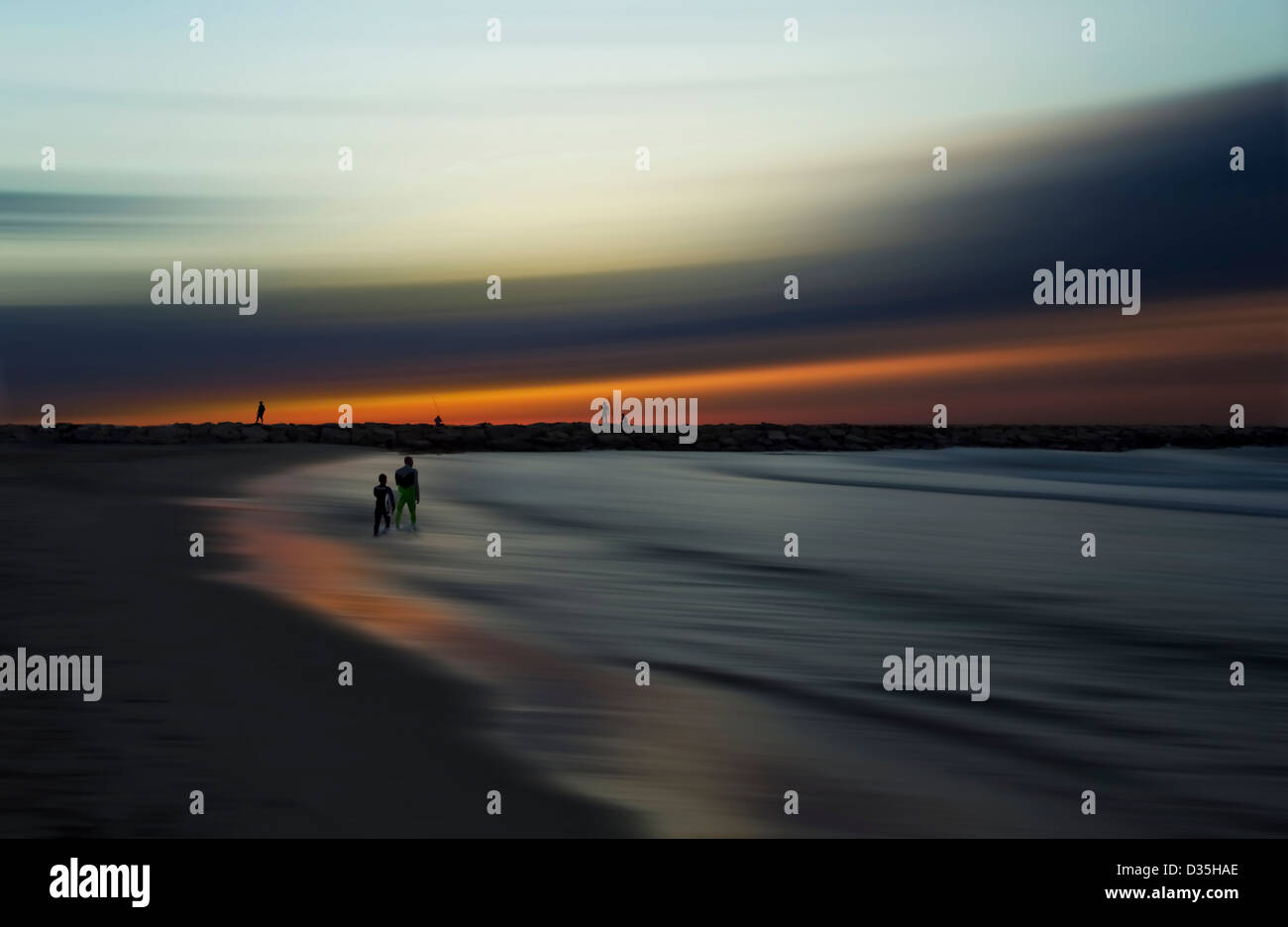 Scenic view with distorted landscape and sky with silhouetted figures ...