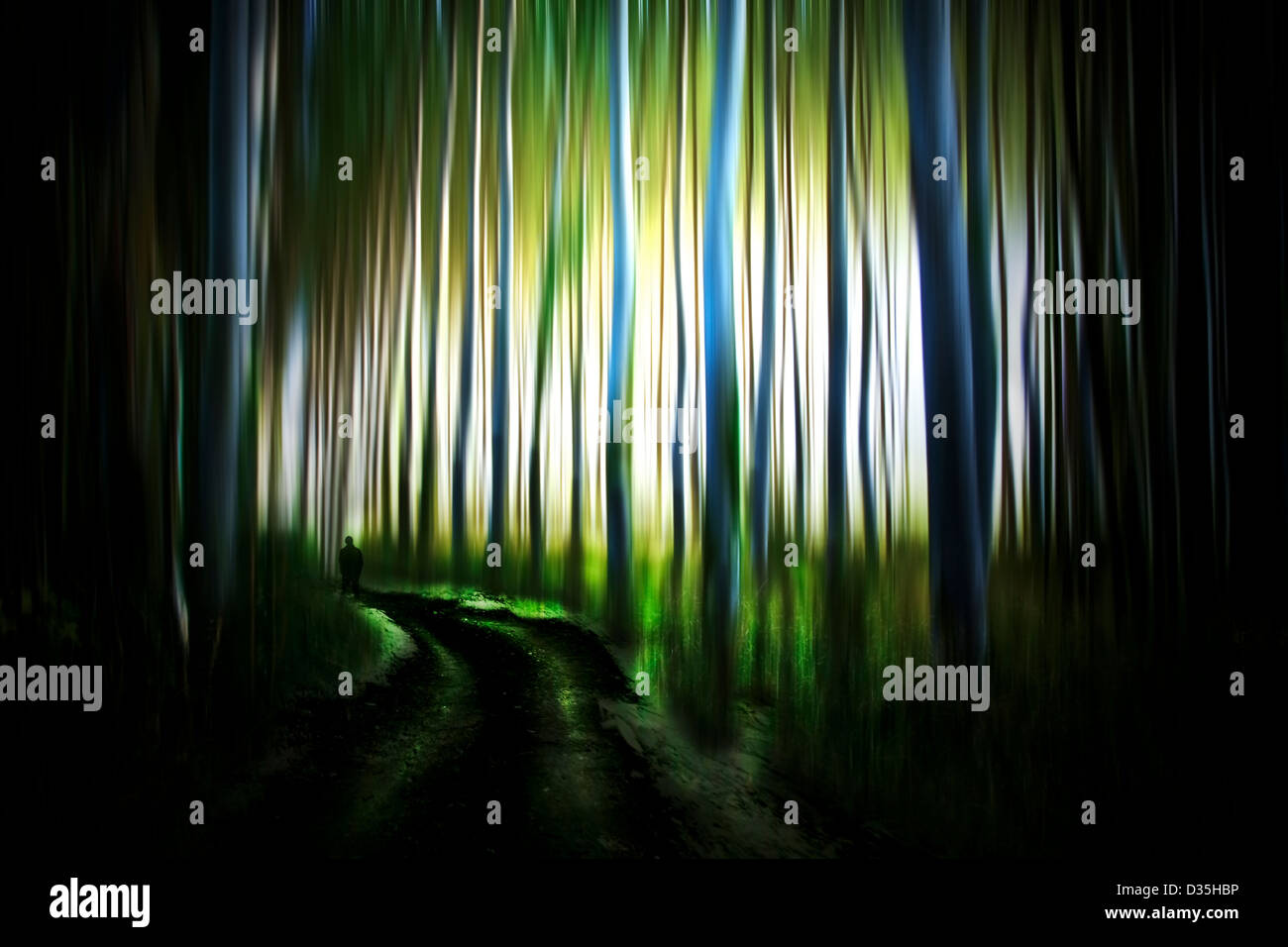 Scenic view with distorted landscape and sky with silhouetted figures ...