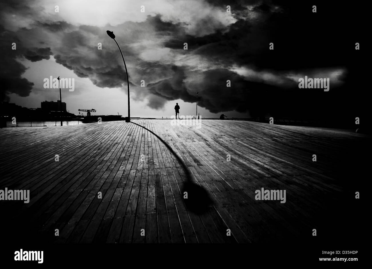 Scenic view with distorted landscape and sky with silhouetted figures ...