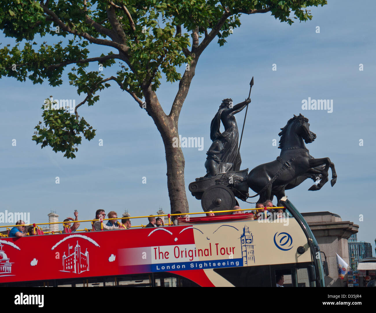 London tour bus with statue of Bodacia opposite Houses of Parliament ...