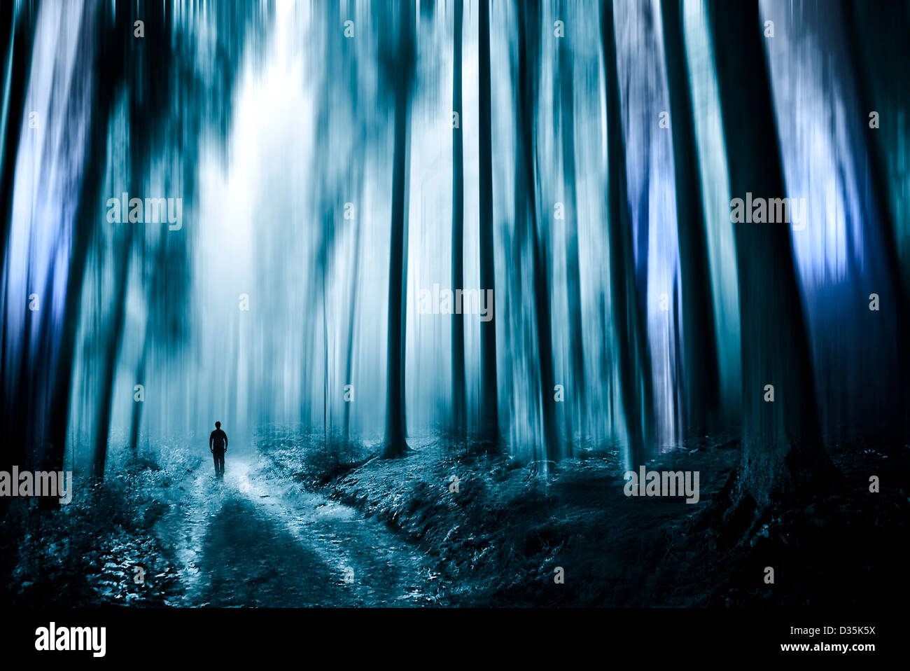 Scenic view with distorted landscape and sky with silhouetted figures ...