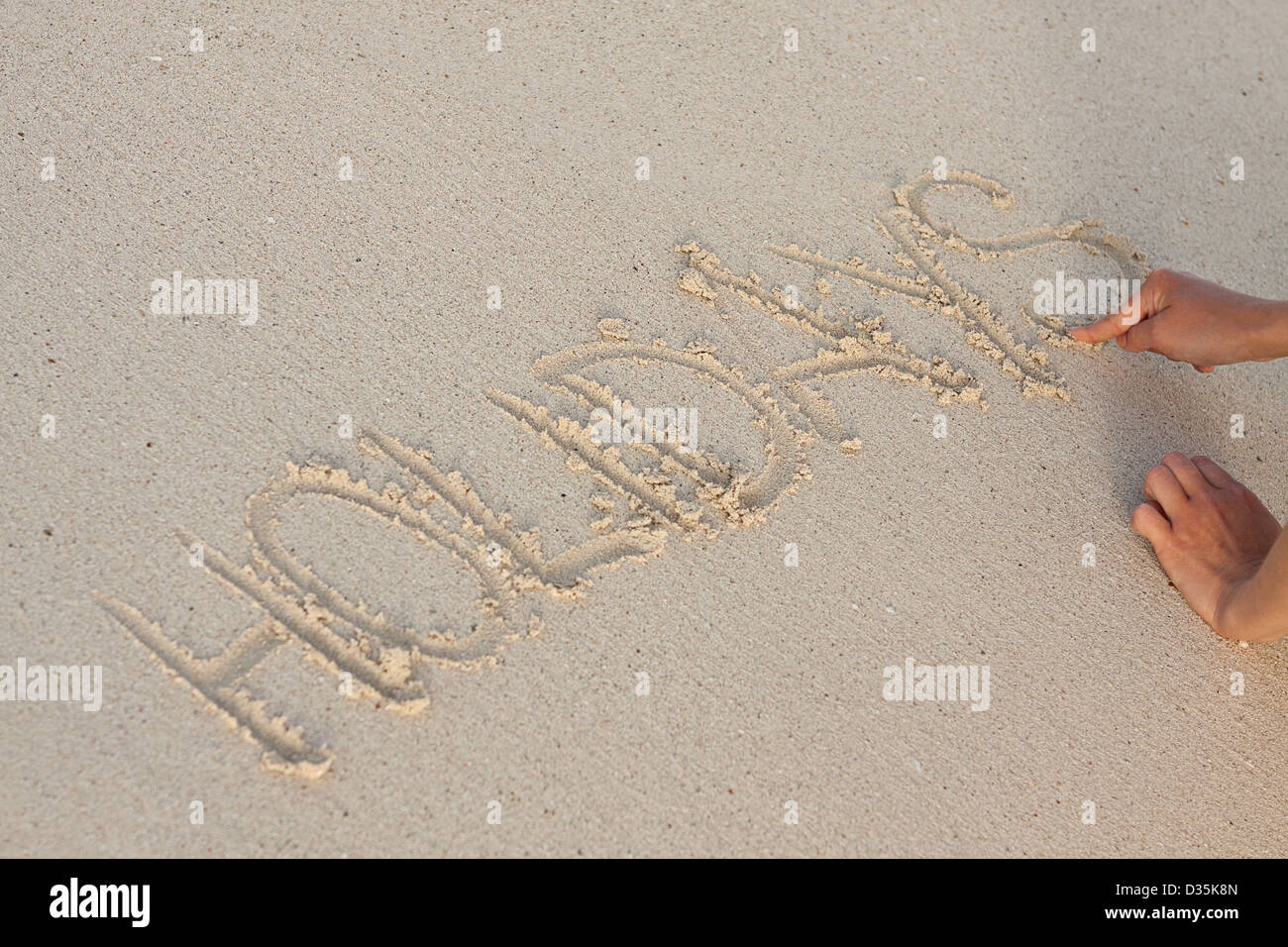 hand writing in sand in summer holiday vacation on beach Stock Photo ...