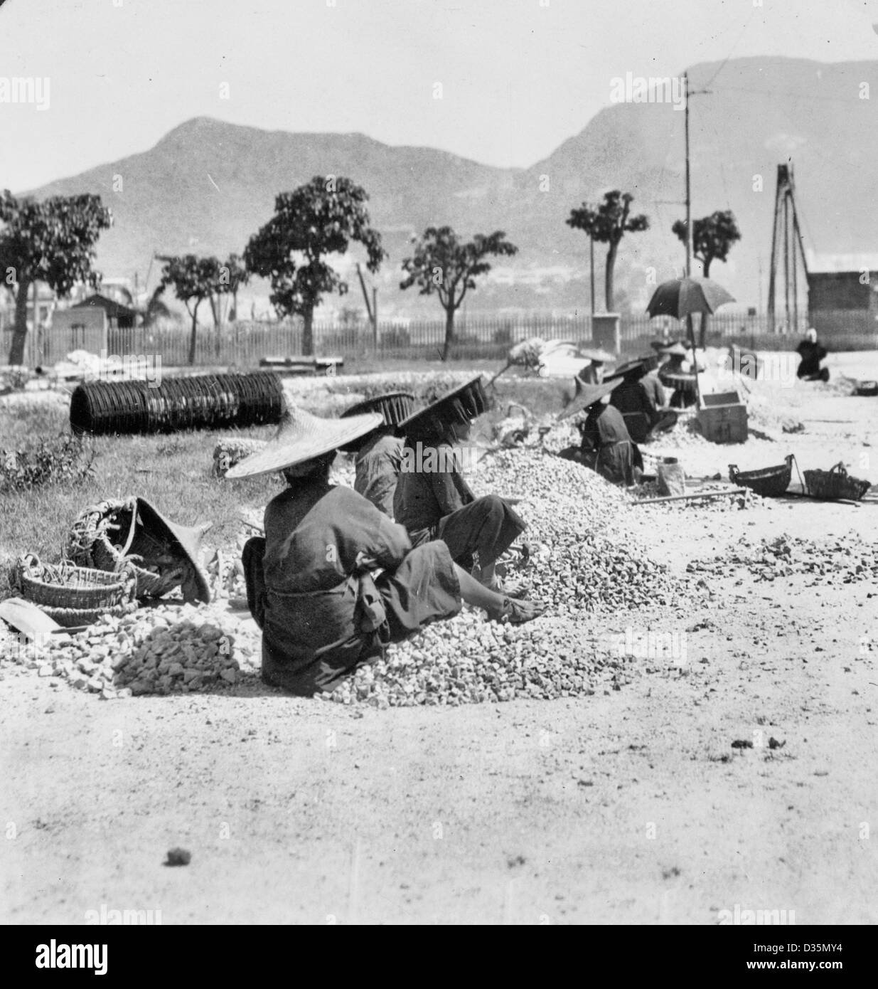 Women breaking rock for road construction in Kowloon, China, circa 1930 ...