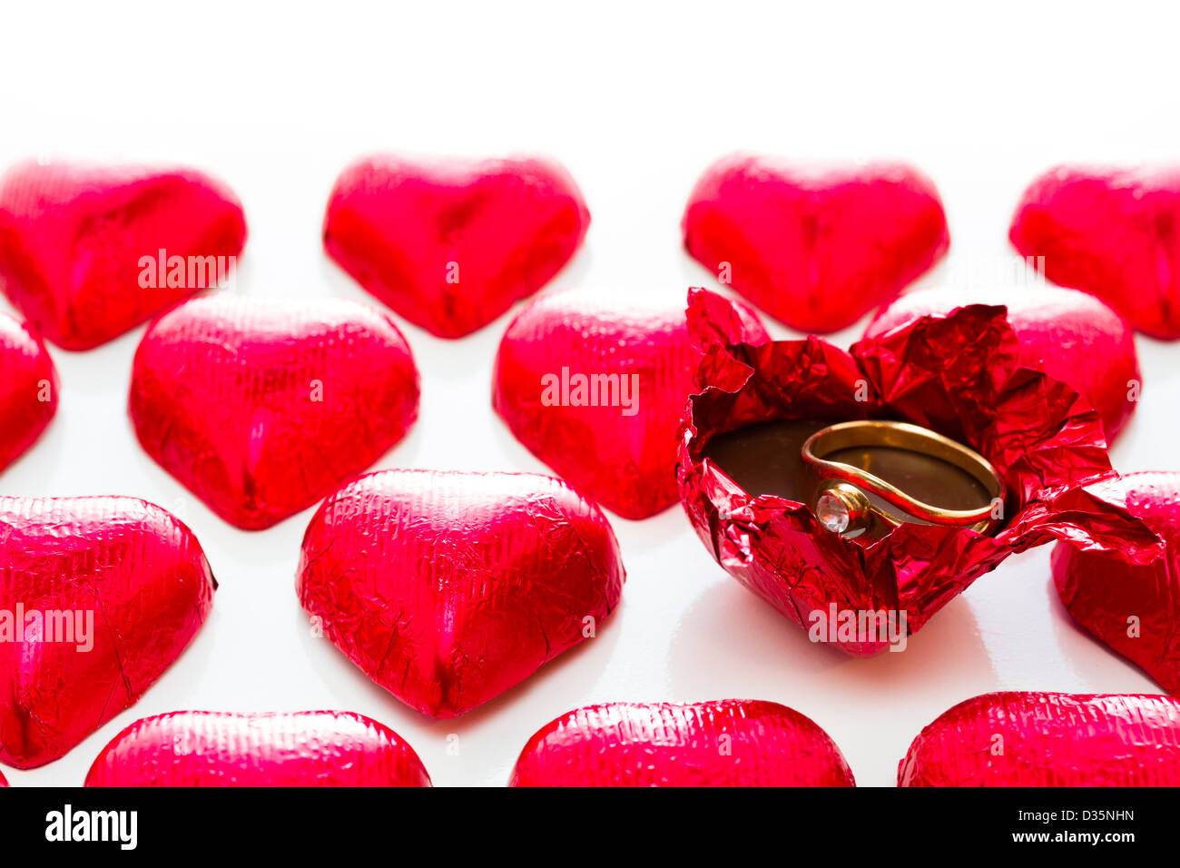 Golden ring with diamond on top of the chocolate candy Stock Photo - Alamy