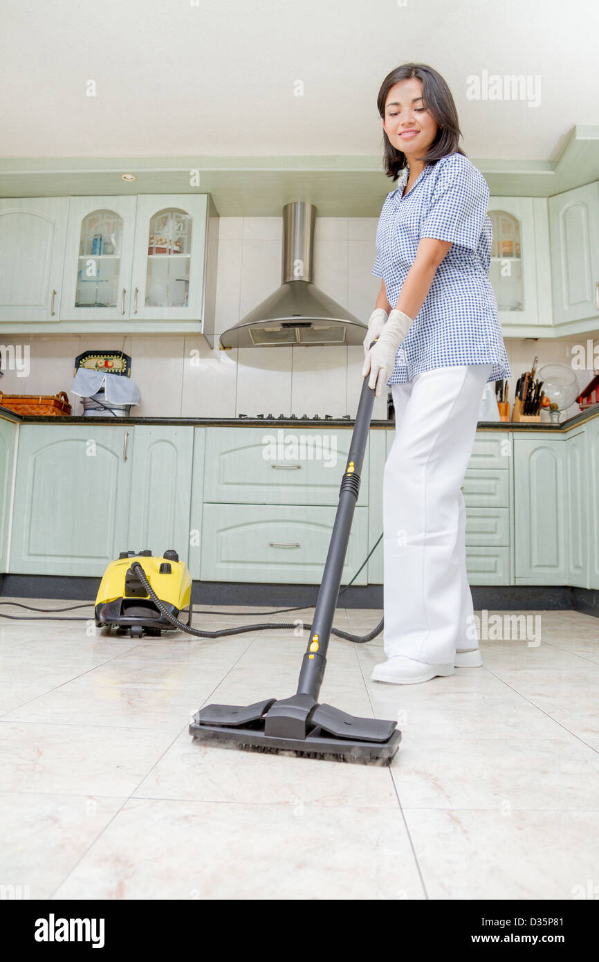 Good looking woman doing the housework Stock Photo - Alamy