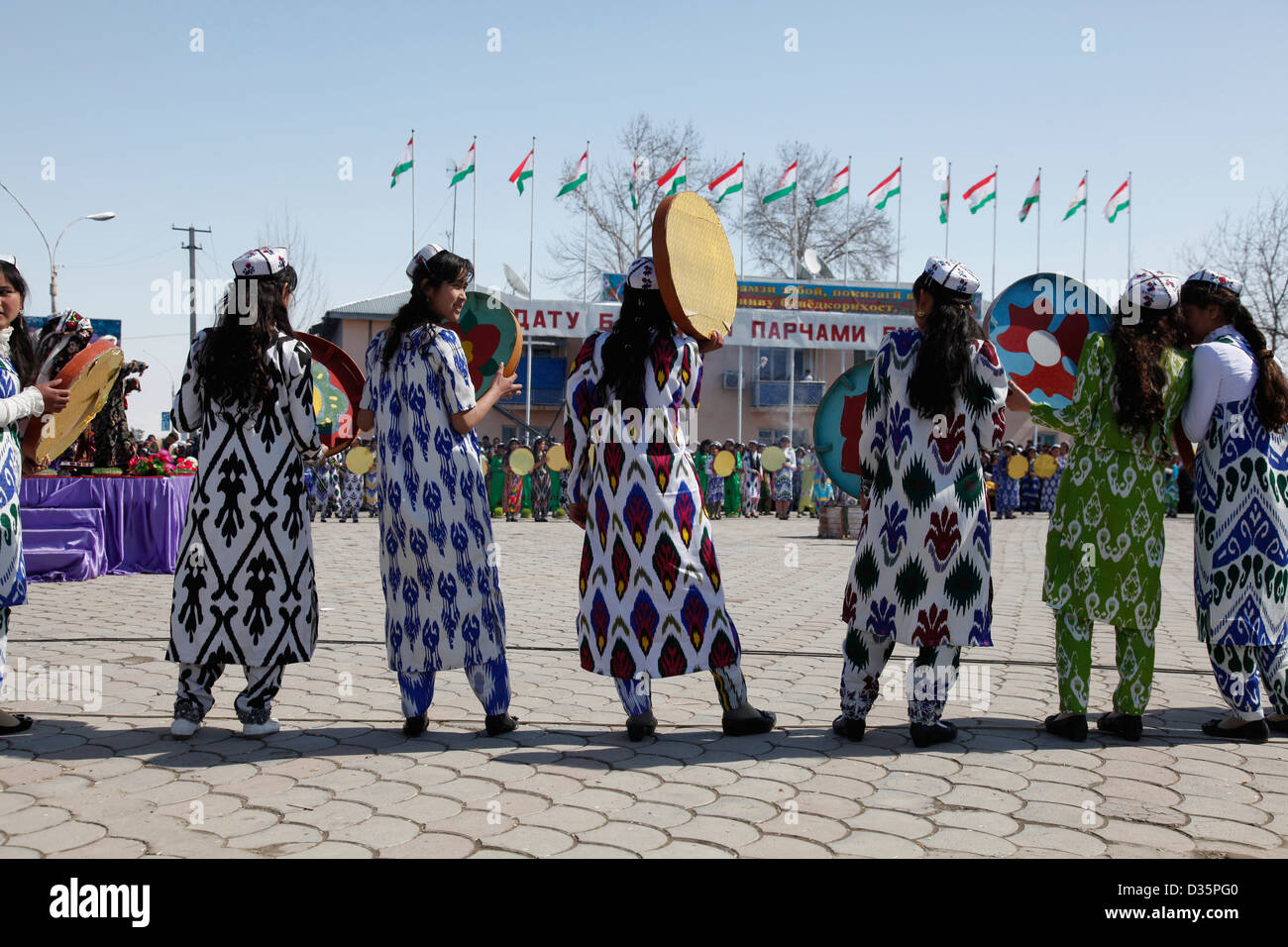Girls in ethnic dresses dance at a Navruz celebration near Dushanbe ...