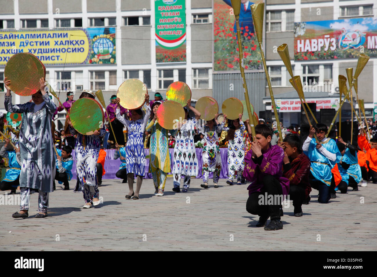Girls in ethnic dresses at a Navruz celebration near Dushanbe ...